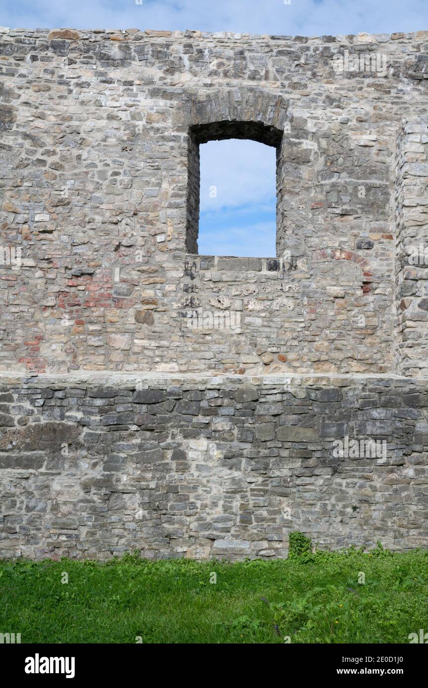 Old, historical and antique wall made of stone. Facade with window ...
