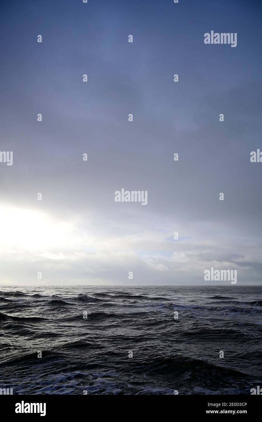 Rough seas and dark clouds with low horizon Stock Photo - Alamy