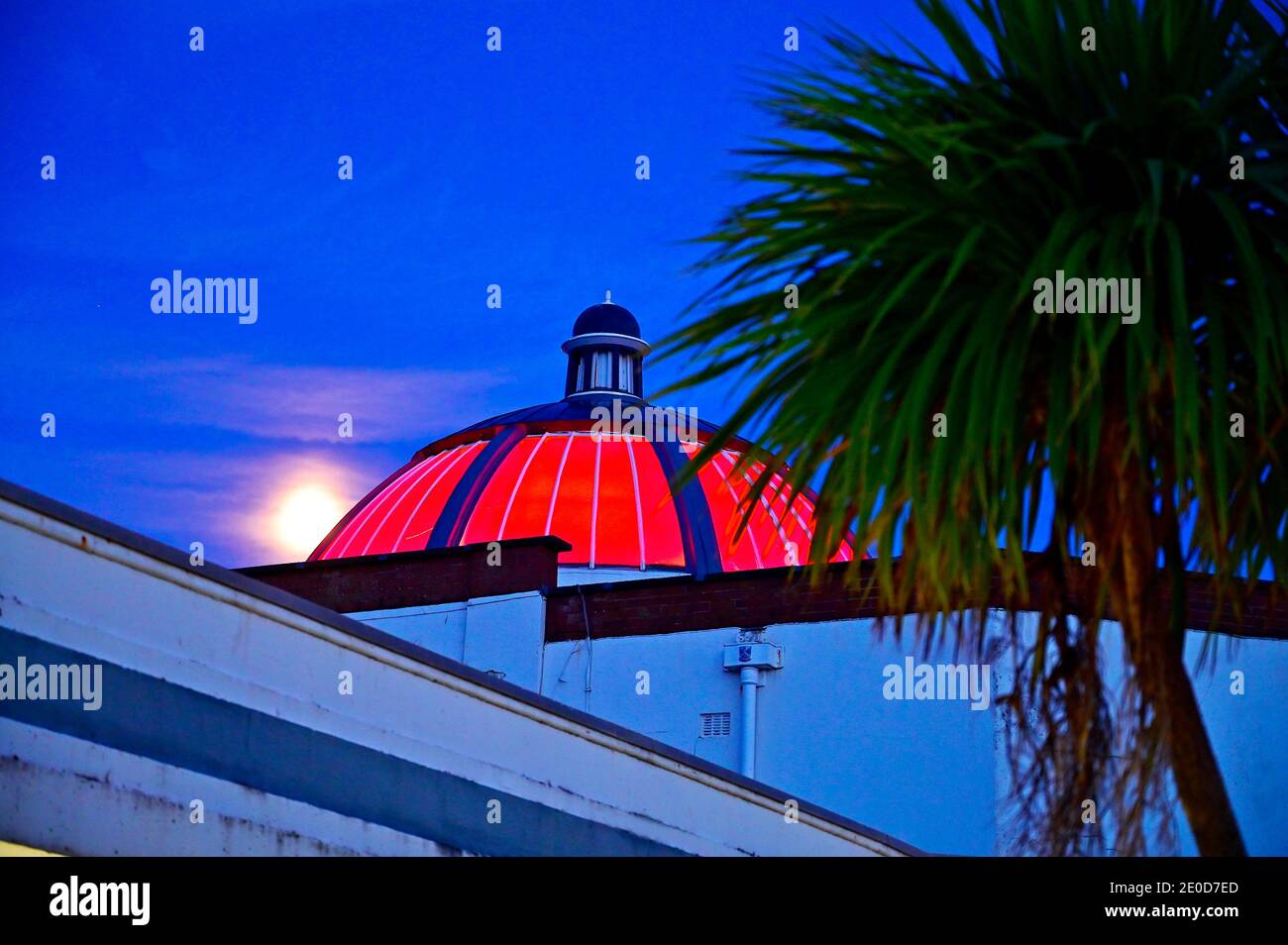Red illuminated dome of the Marine Hall entertainment venue in ...