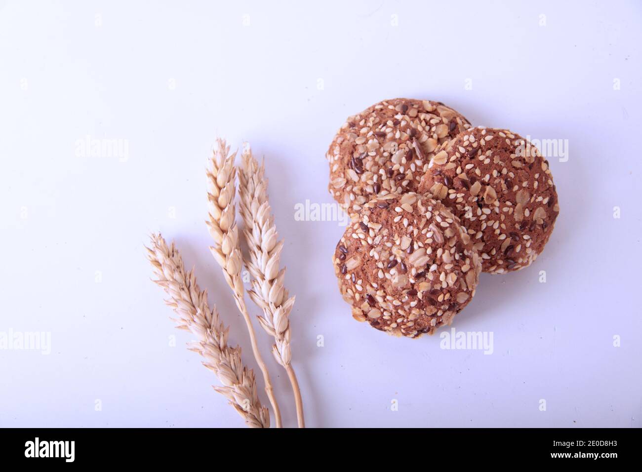 whole grain cookies and ears of wheat isolated on white background flat ...