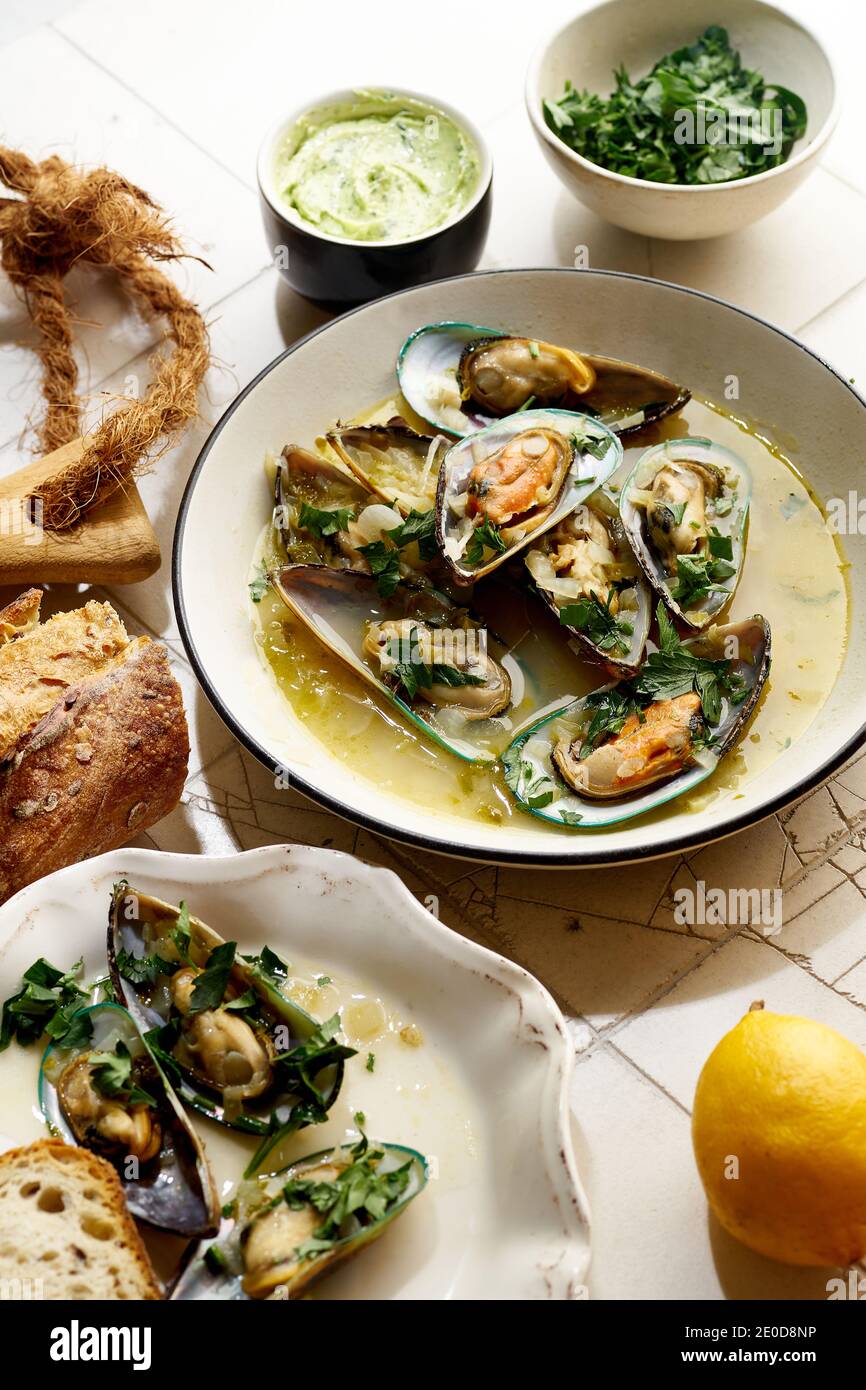Cooked kiwi green mussels with wine, garlic and parsley served with ...