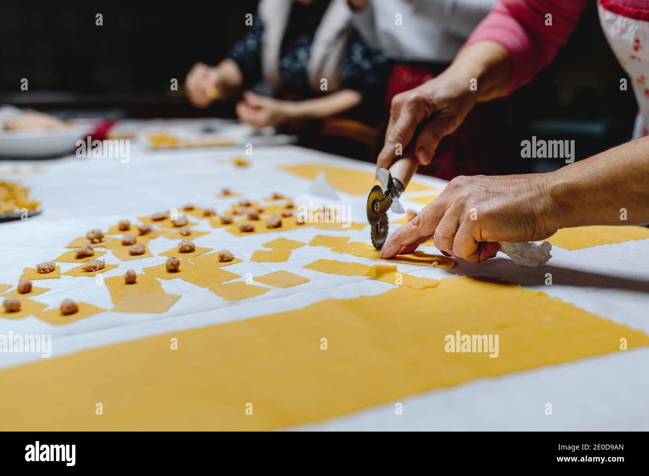 Side view of female explorer sitting in woods in cold season and ...