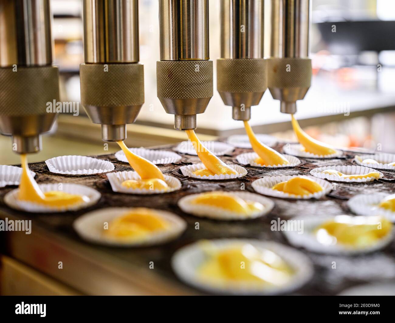 Automatic industrial dough filling machine used during process of ...