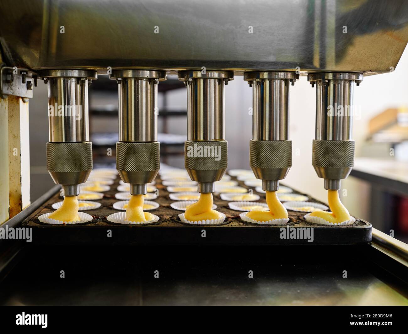 Automatic industrial dough filling machine used during process of ...