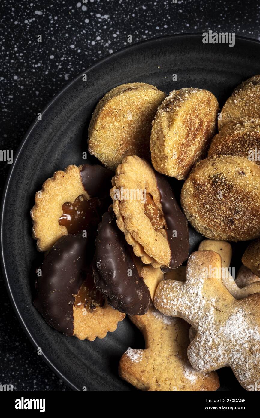 From above of delicious baked homemade cookies placed on tray on black ...