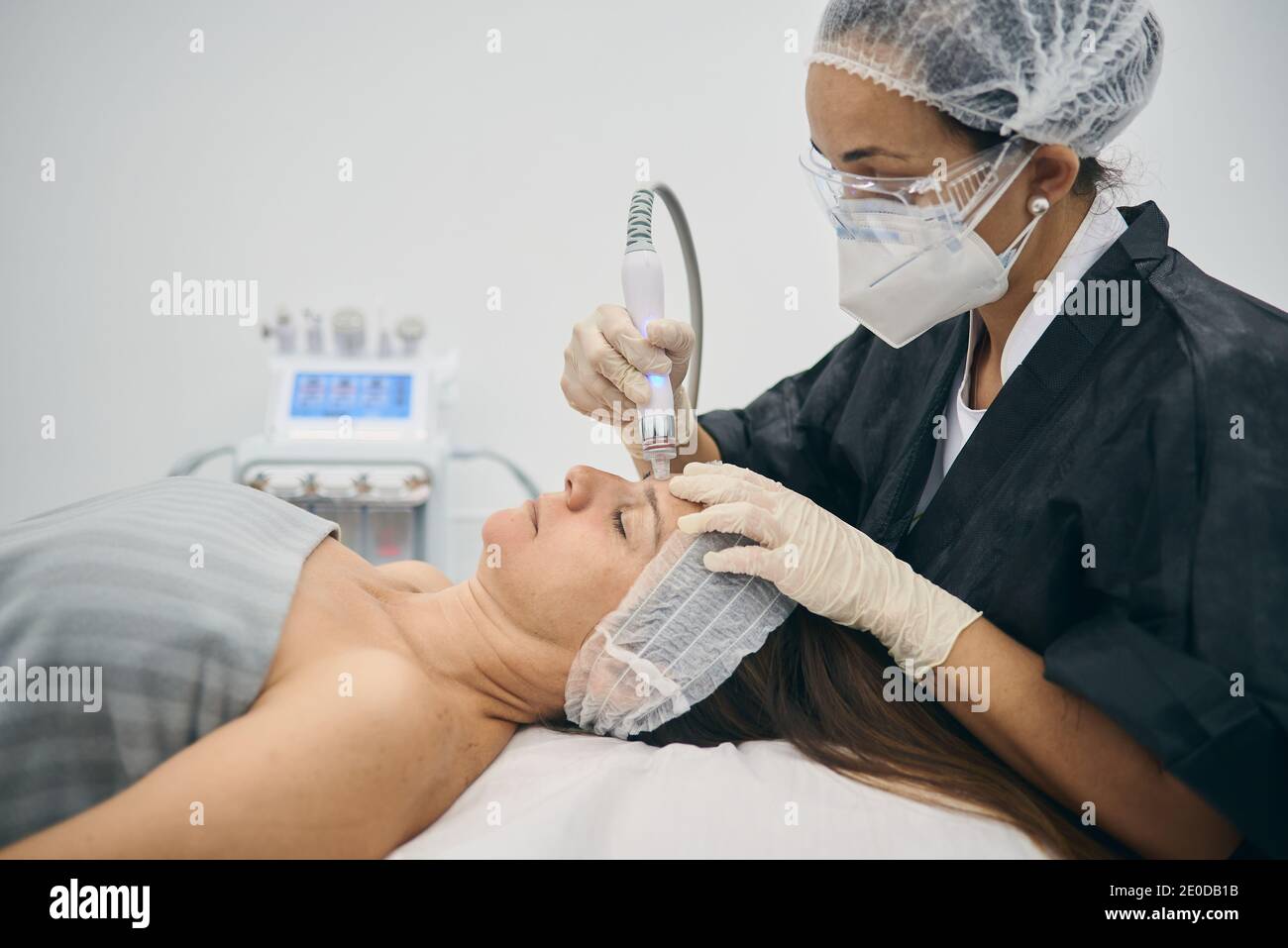 Dermatologist wearing protective face hi-res stock photography and ...