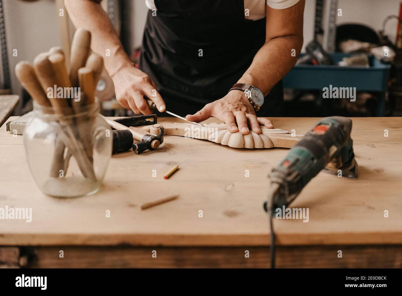 Unrecognizable carpenter using sharp hi-res stock photography and ...