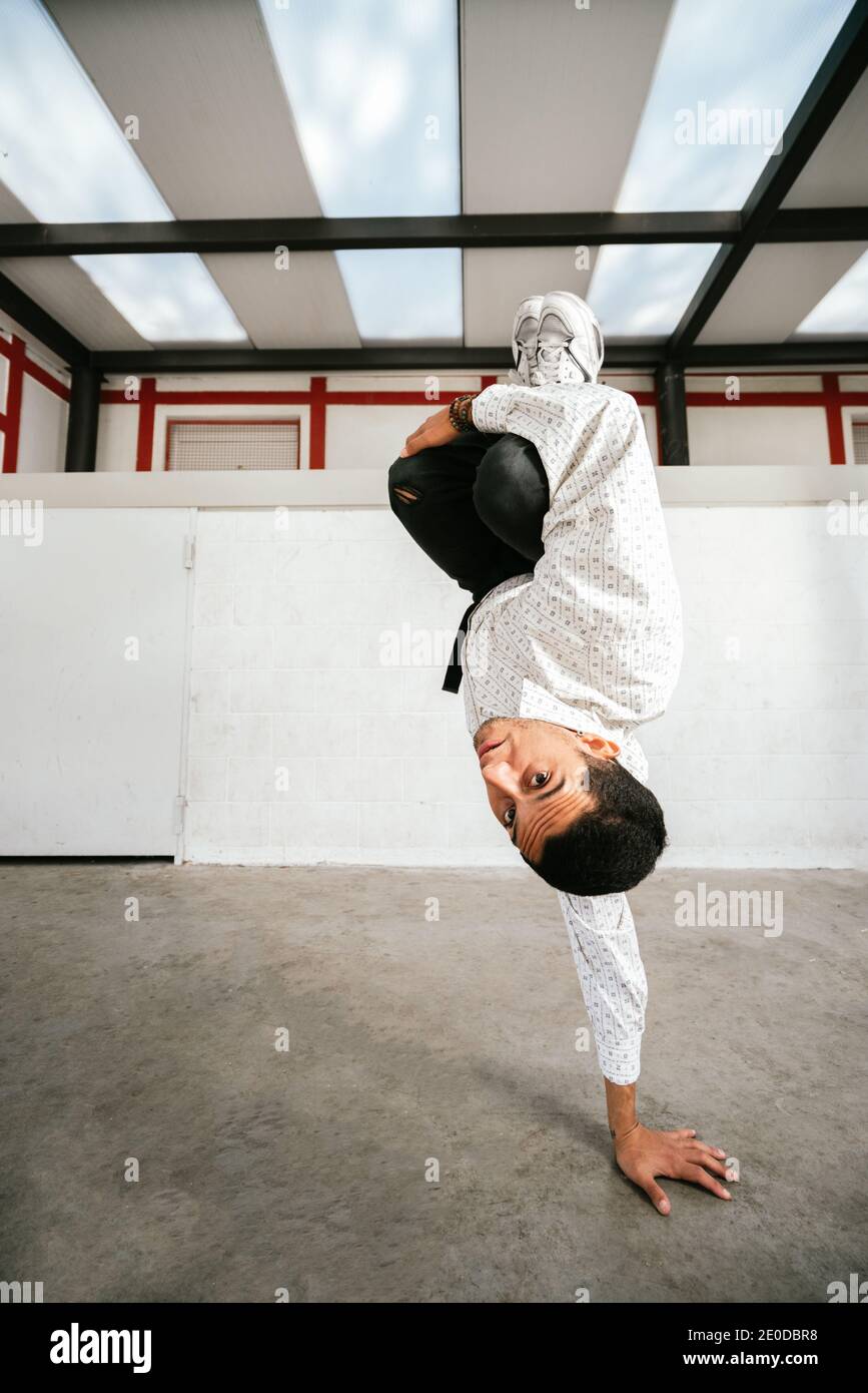 Man performing acrobatic handstand hi-res stock photography and images ...