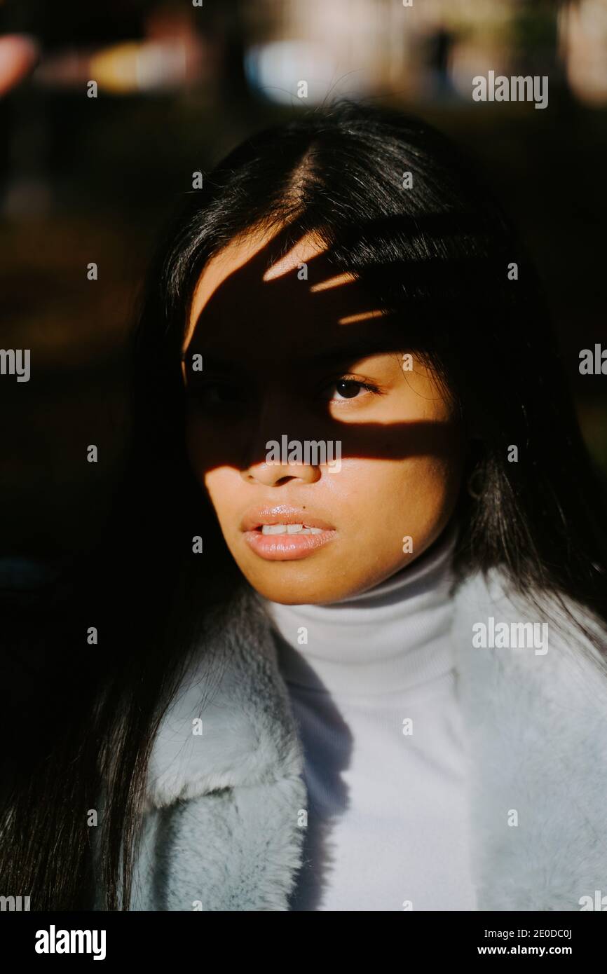 Woman covering face in sunny hi-res stock photography and images - Alamy