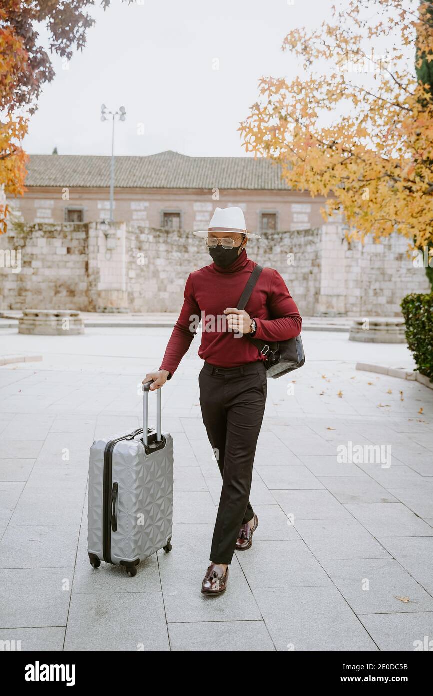 Smiling native American female in traditional clothes stretching out ...