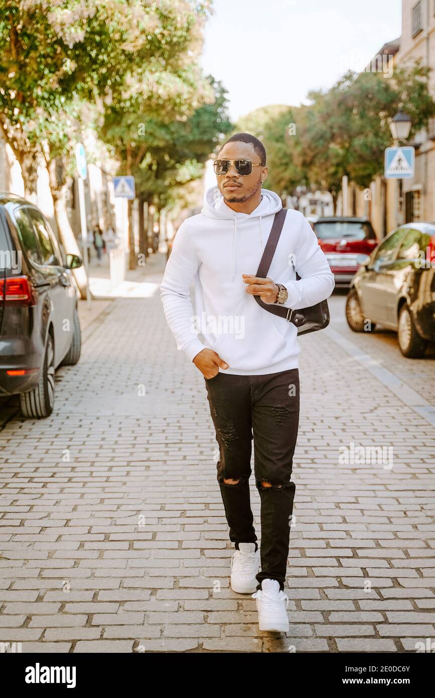 Man walking away street cool hi-res stock photography and images - Alamy