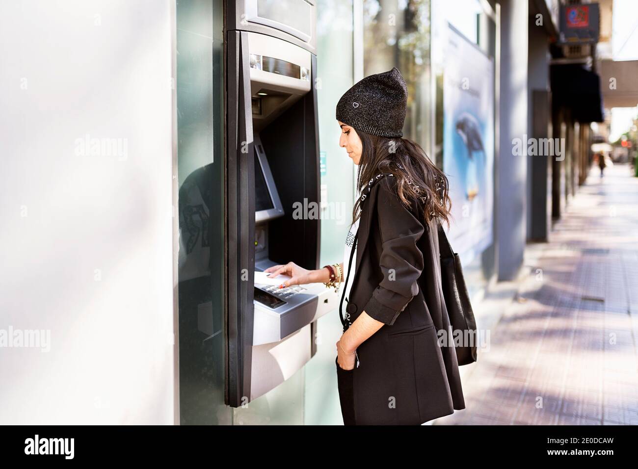 Woman using atm machine hi-res stock photography and images - Alamy