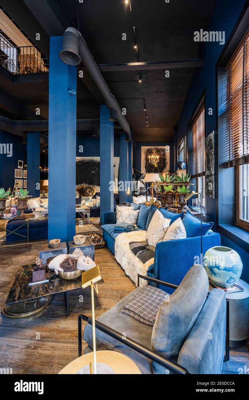 Modern interior design with comfortable soft sofa and chairs in lounge ...