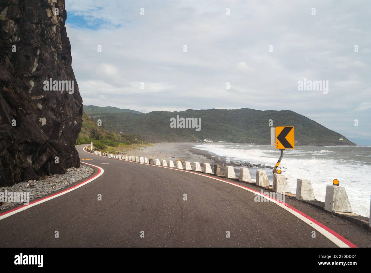 Amazing view of empty asphalt roadway surrounded by waving sea and ...