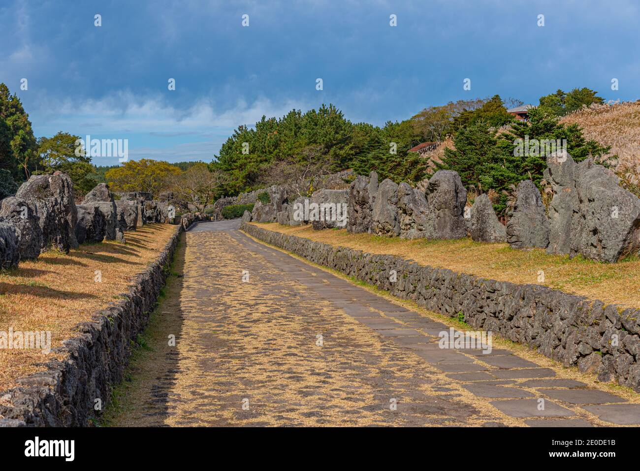 Stone statues at the entrance to Sangumburi crater at Jeju island ...
