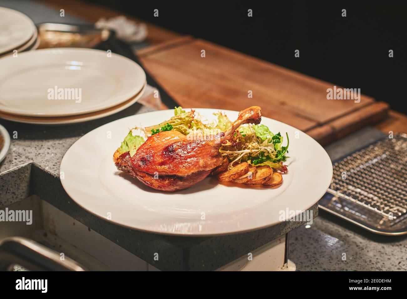 Chefs preparing beautiful dishes in French restaurant's kitchen Stock ...