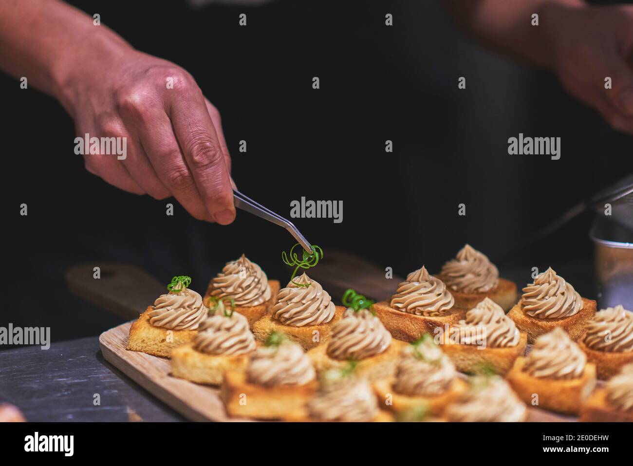 Chefs preparing beautiful dishes in French restaurant's kitchen Stock ...
