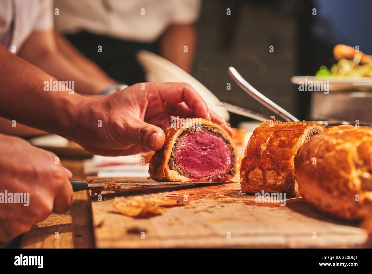 Chefs preparing beautiful dishes in French restaurant's kitchen Stock ...