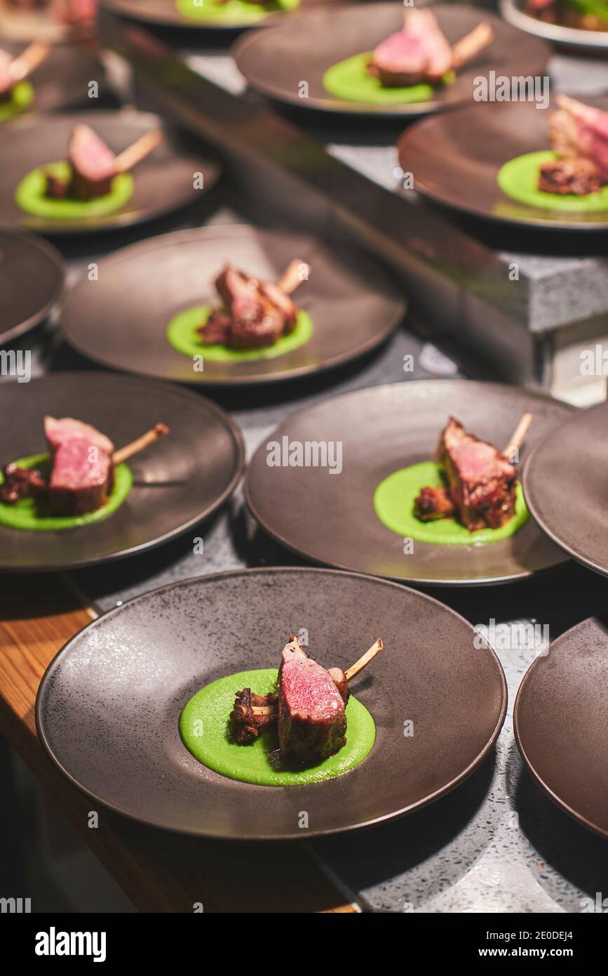 Chefs preparing beautiful dishes in French restaurant's kitchen Stock ...