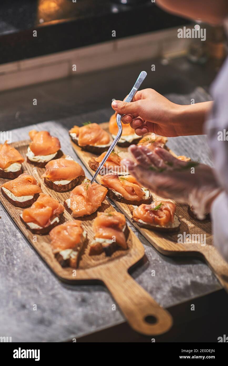 Chefs preparing beautiful dishes in French restaurant's kitchen Stock ...