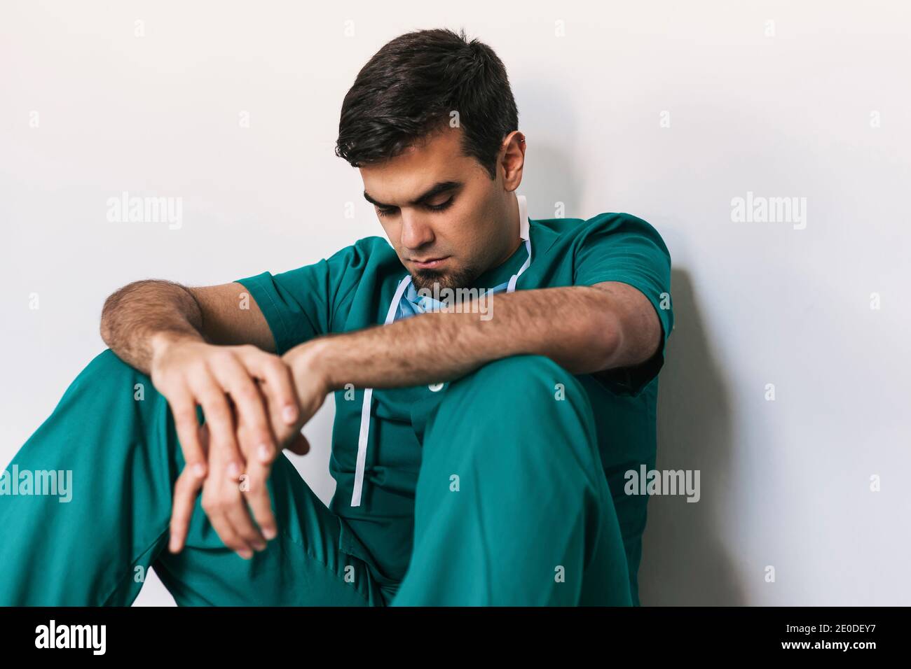 Exhausted doctor sitting on floor hi-res stock photography and images ...