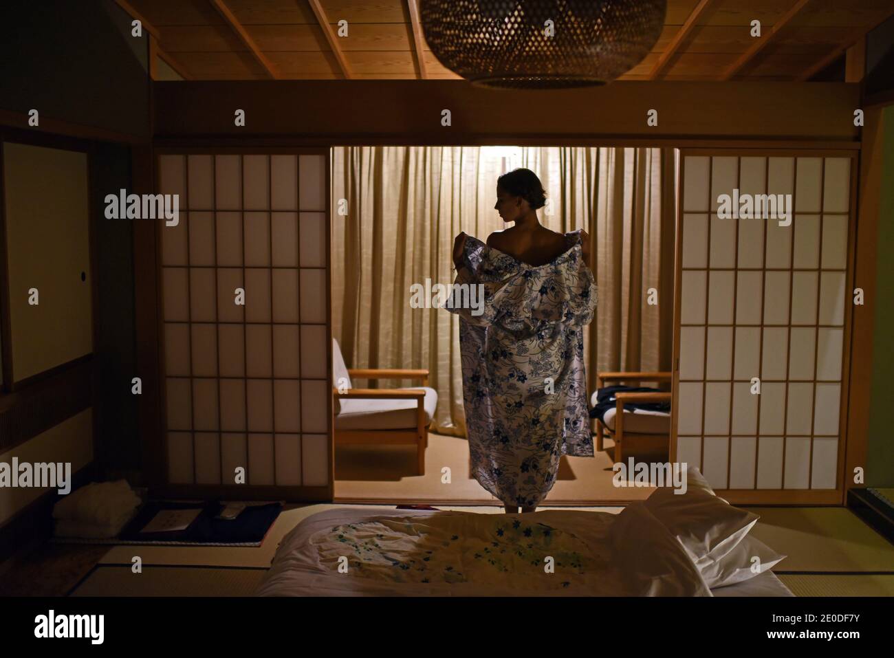 Young caucasian Woman in Japanese kimono undressing at night in ...