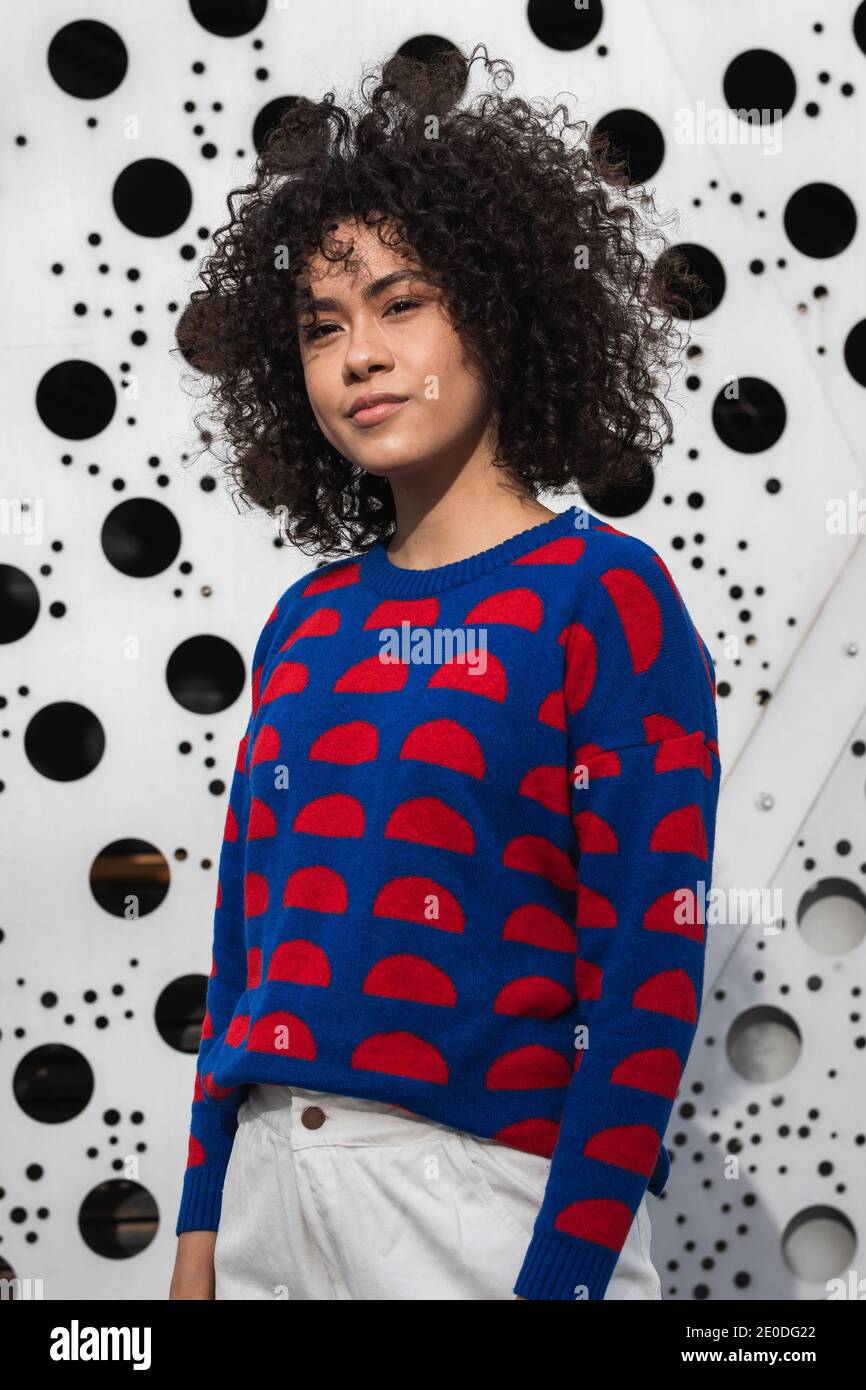 Carefree African American Female In Stylish Outfit And With Curly Hair