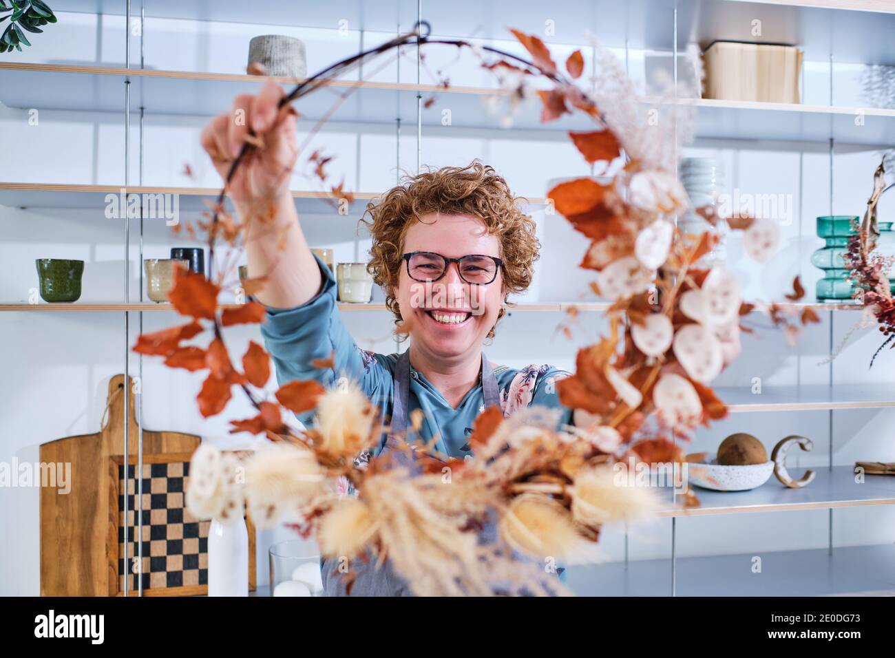 Cool female in street style outfit smoking e cigarette and exhaling ...