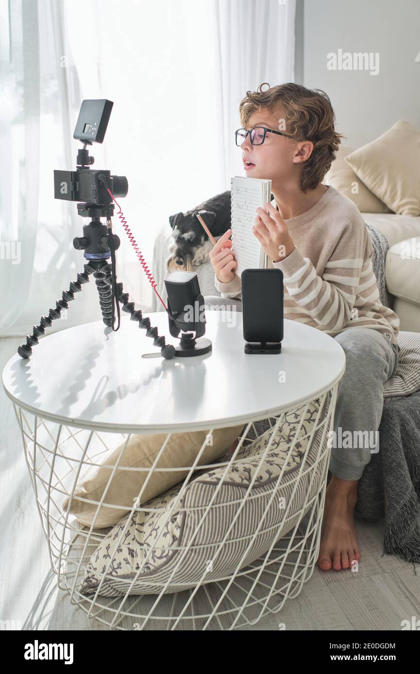 Adorable boy in his living room recording himself with camera Stock ...