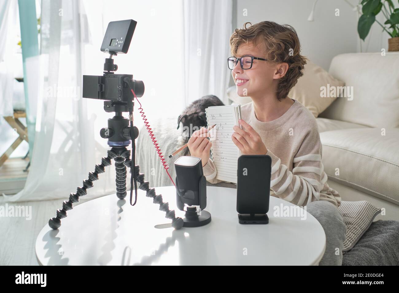Adorable boy in his living room recording himself with camera Stock ...