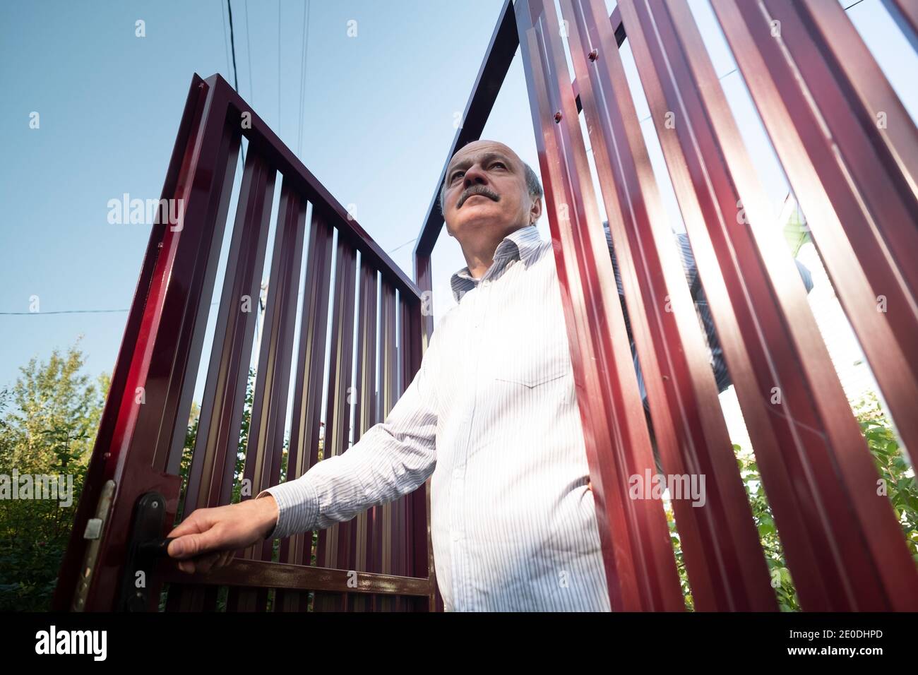Man looking at neighbour hi-res stock photography and images - Alamy