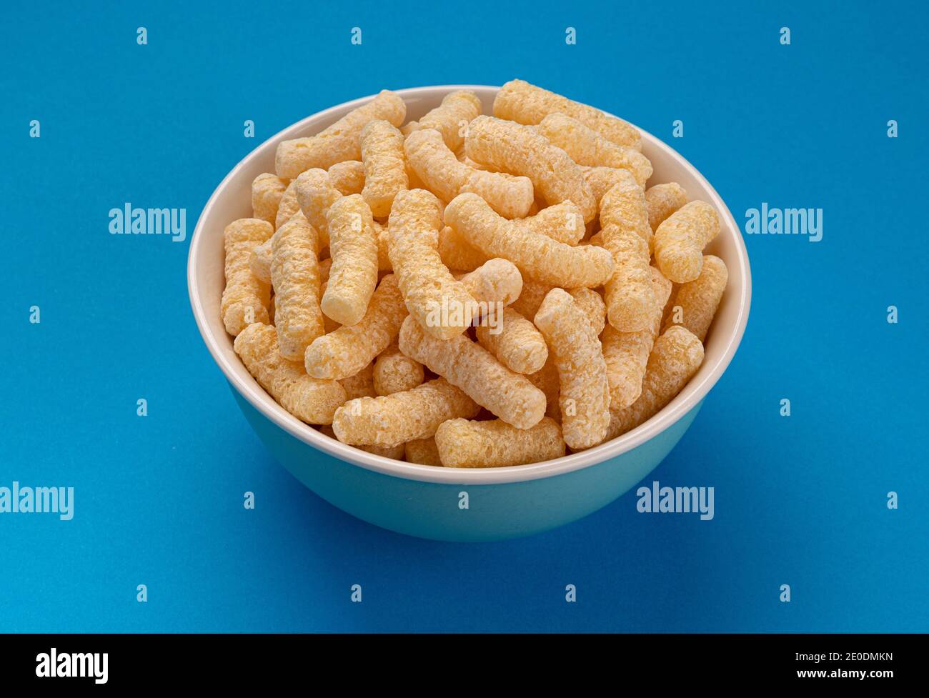 Sweet corn sticks isolated on blue background Stock Photo - Alamy
