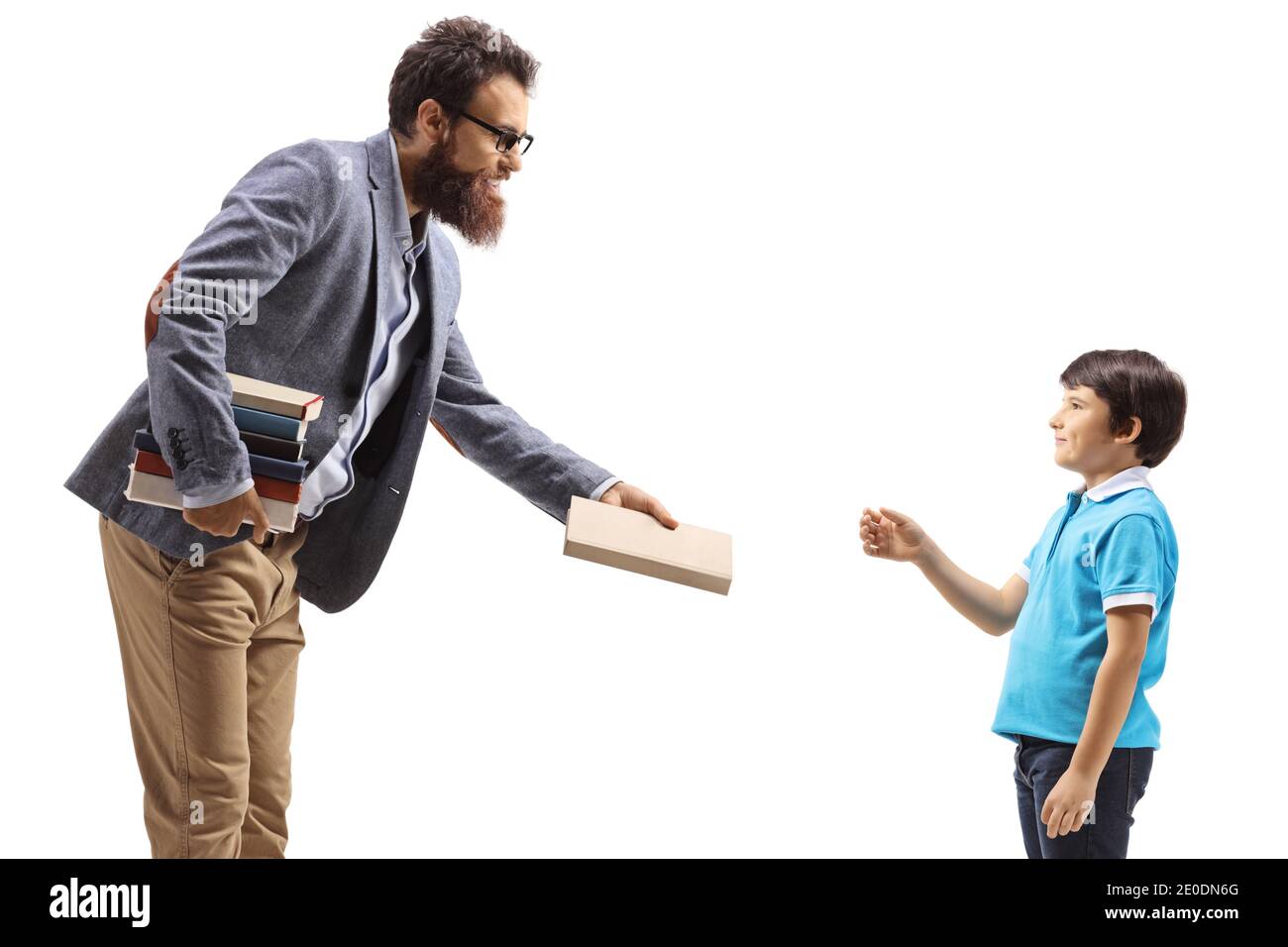 Man giving a book to a boy isolated on white background Stock Photo - Alamy
