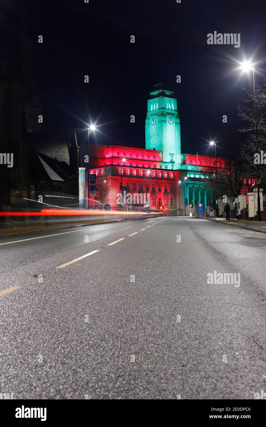 Parkinsons Building of Leeds Uiversity lit up in Red & Green Stock ...