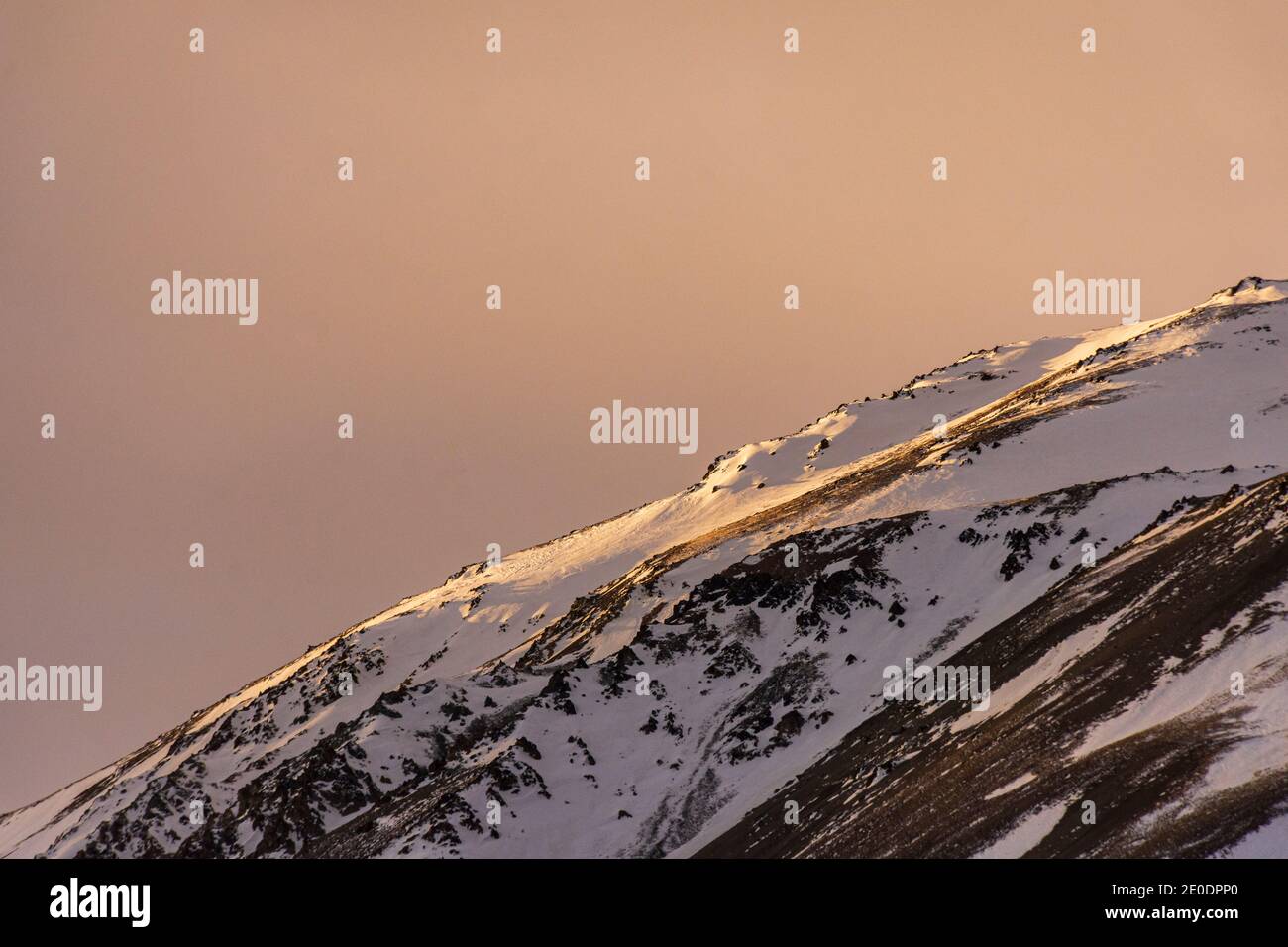 Alpenglow over snow-capped Andes mountains during sunset in Esquel ...