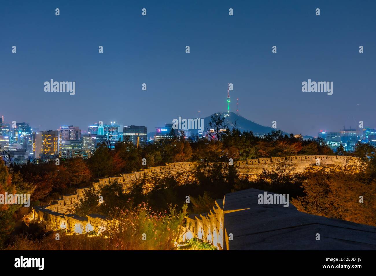 Namsan tower viewed behind an ancient wall at Inwangsan mountain in ...