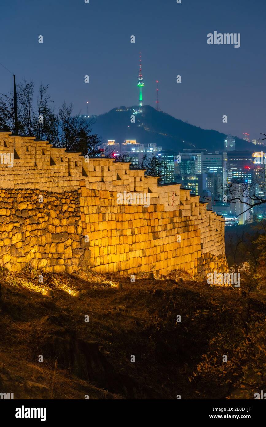 Namsan tower viewed behind an ancient wall at Inwangsan mountain in ...