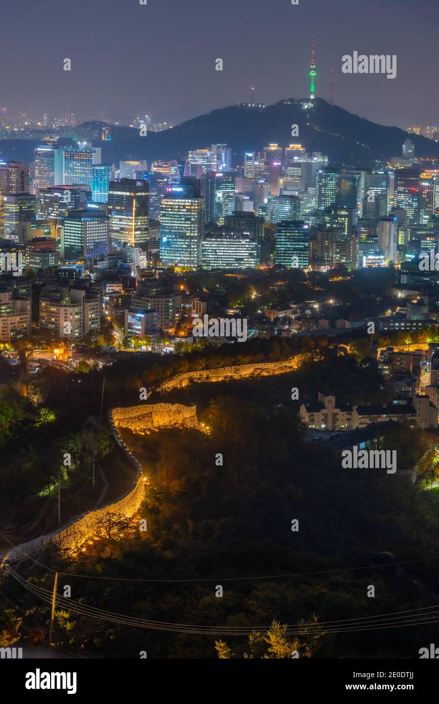 Namsan tower viewed behind an ancient wall at Inwangsan mountain in ...