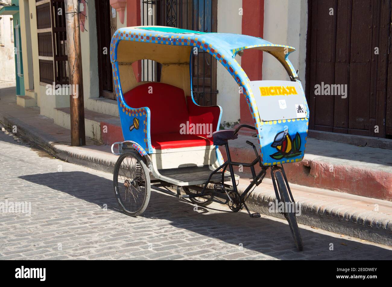 Bicycle Taxi or Bicitaxi, parked in street, Camaguey, Cuba Stock Photo ...