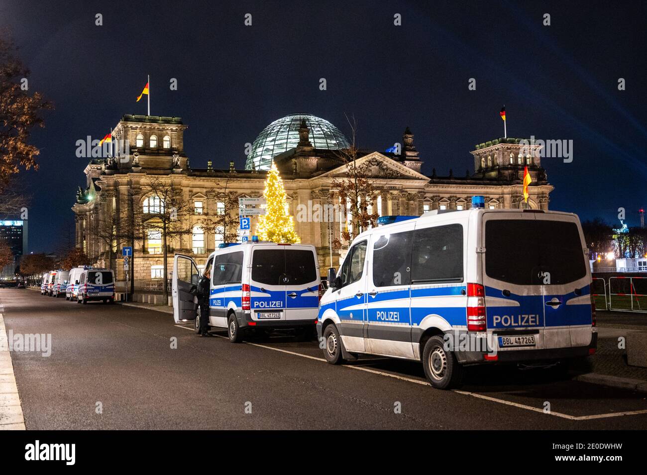 Berlin, Germany. 31st Dec, 2020. Police cars are parked in front of the ...