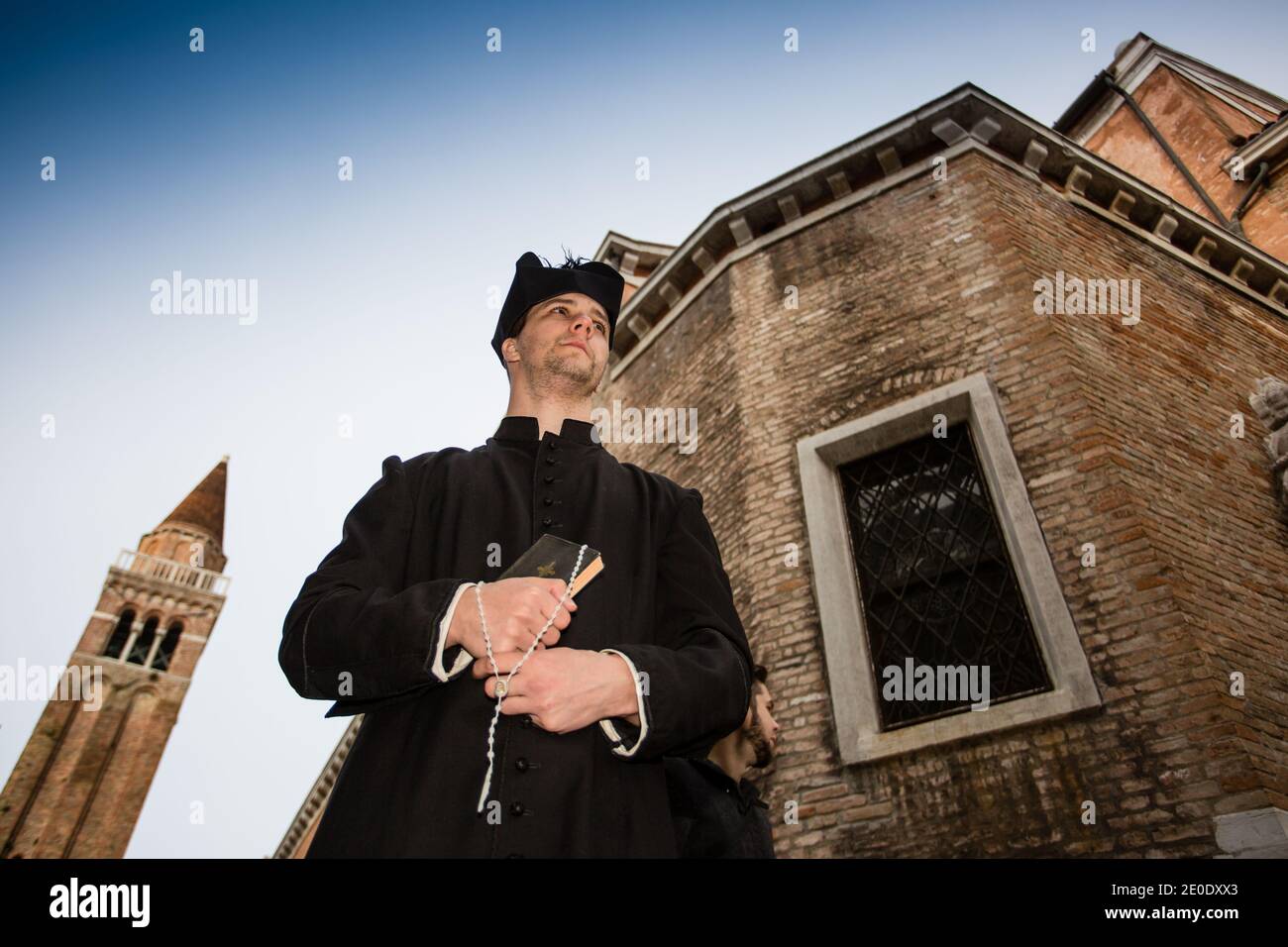Handsome catholic priest holding hi-res stock photography and images ...