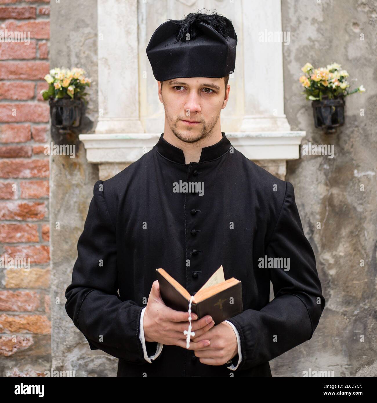 Handsome catholic priest holding hi-res stock photography and images ...