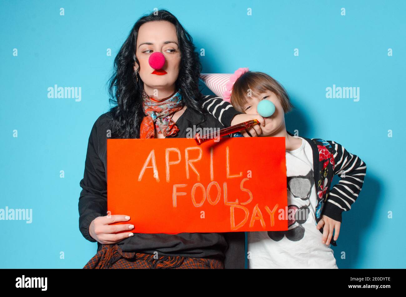Mom and daughter celebrate their birthday. Festive outfits. The concept ...