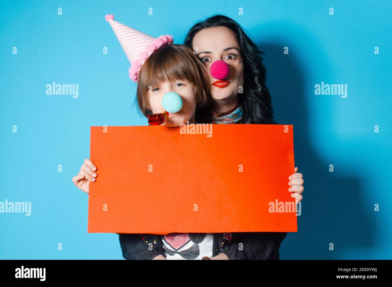 Mom and daughter celebrate their birthday. Festive outfits. The concept ...