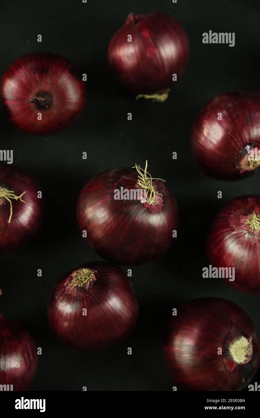 sweet red onions on background Stock Photo - Alamy