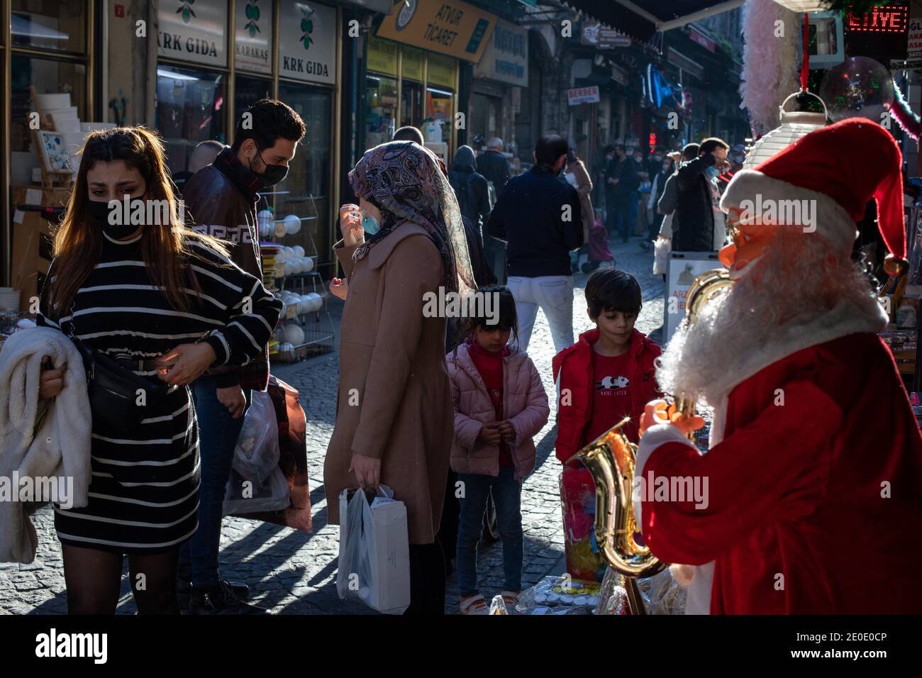 People shopping at the historic Eminonu bazaar on the last day of 2020 before New Year's Eve ...
