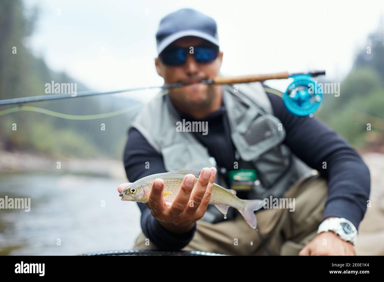 Man holding fish portrait hi-res stock photography and images - Alamy