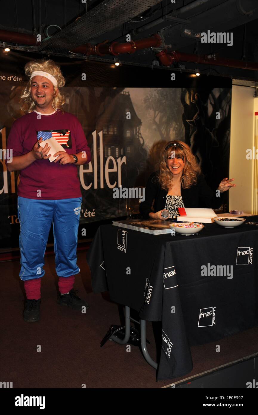 French author Sophie Audouin-Mamikonian signs copies of her latest book ...