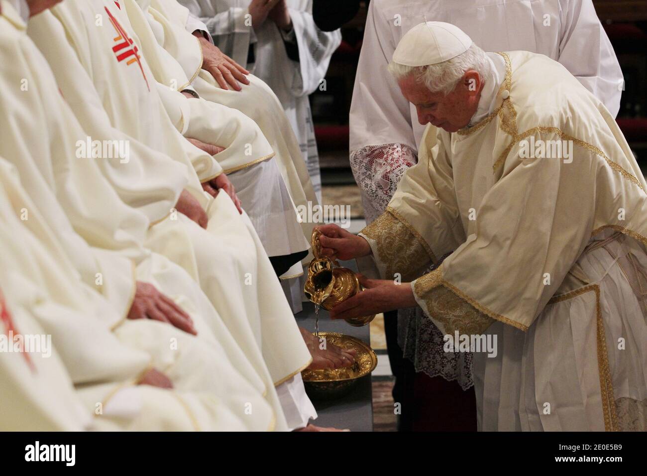 Pope Benedict XVI celebrates the foot washing service during the mass ...