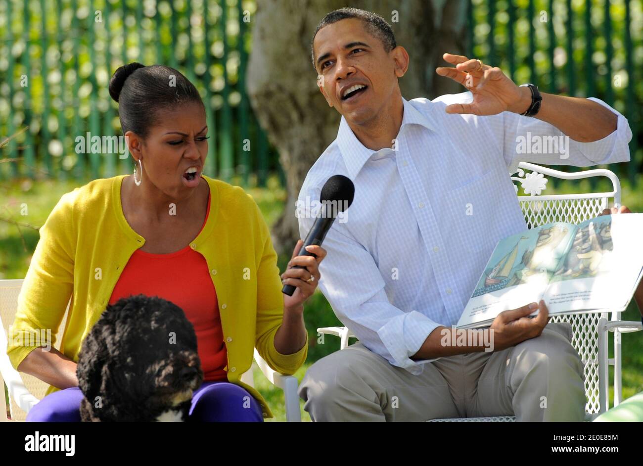 U.S. President Barack Obama makes a scary face as he reads from the ...